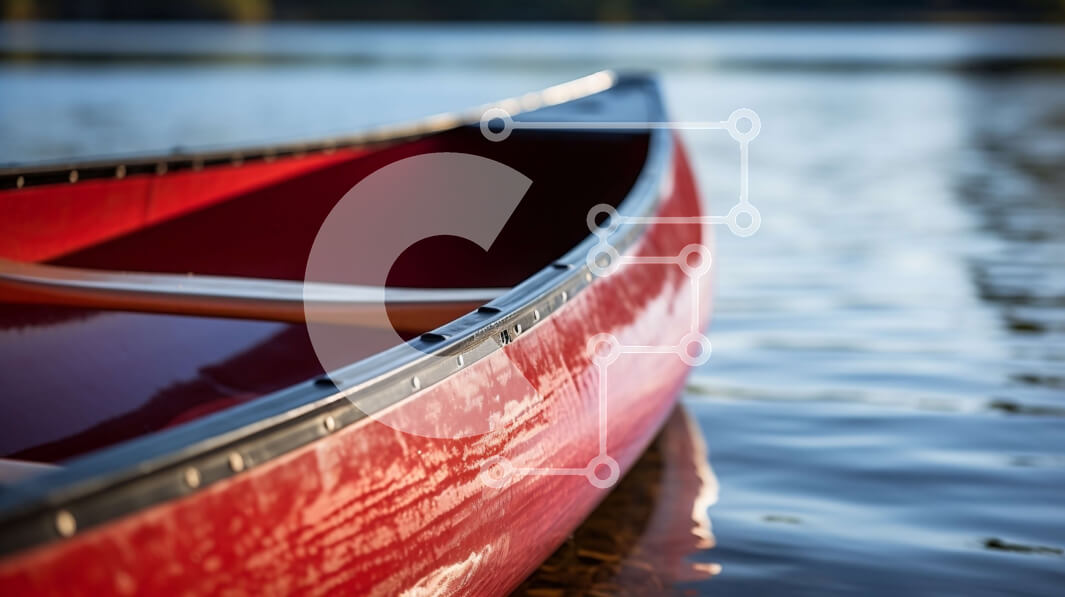 Download Red Canoe on a Calm Lake Surrounded by Trees and Mountains ...