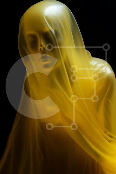 Yellow-clad Figure Posing in Front of a Black Background stock photo ...