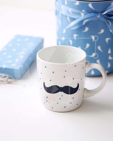 Intricate Mustache Coffee Mug with Blue Boxes and Gift Card stock photo ...