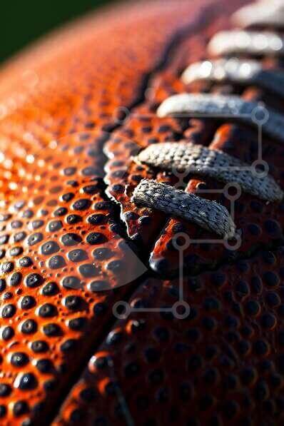 Close-up of an Orange Football Ball stock photo | Creative Fabrica