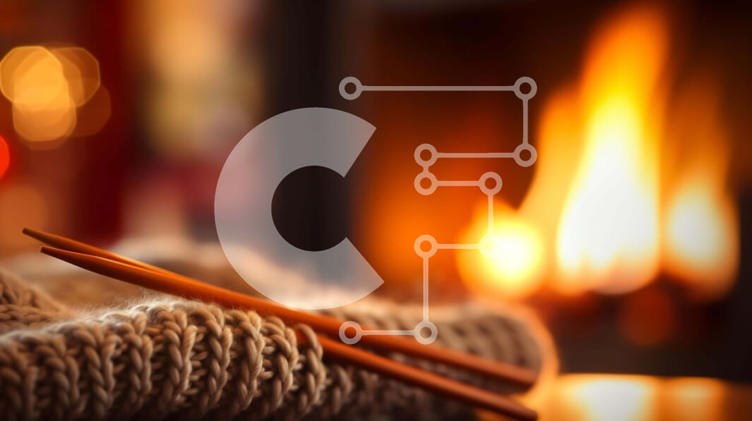 Descarga Suéter de punto y agujas de tejer crochet junto a la chimenea ...