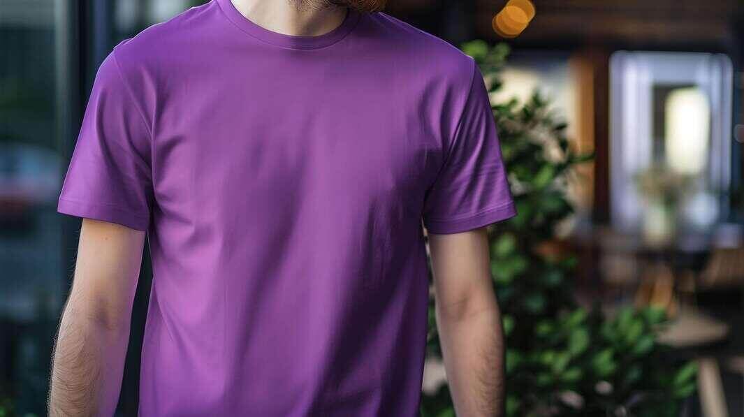 Download Man in a Purple T-Shirt Standing in Front of a Building with ...