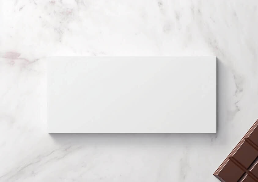 Download White Chocolate Bar and Empty Cardboard Box on Marble Table ...
