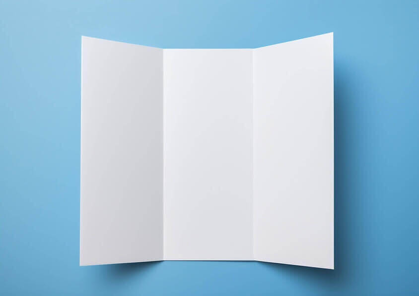 Download Folded White Paper Brochure on Blue Background Mockups Online ...