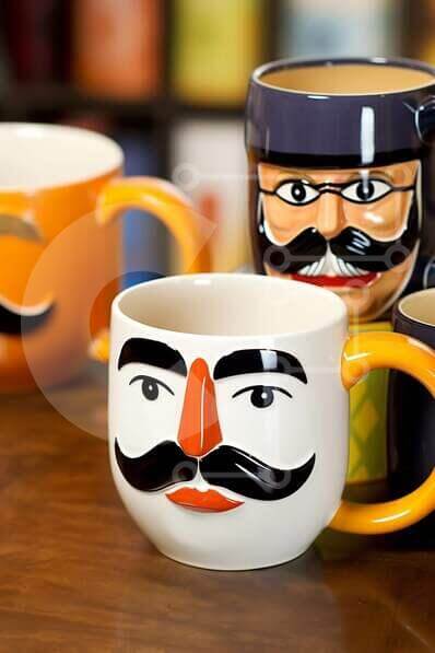 Unique Decorated Coffee Mugs with Facial Designs stock photo | Creative ...