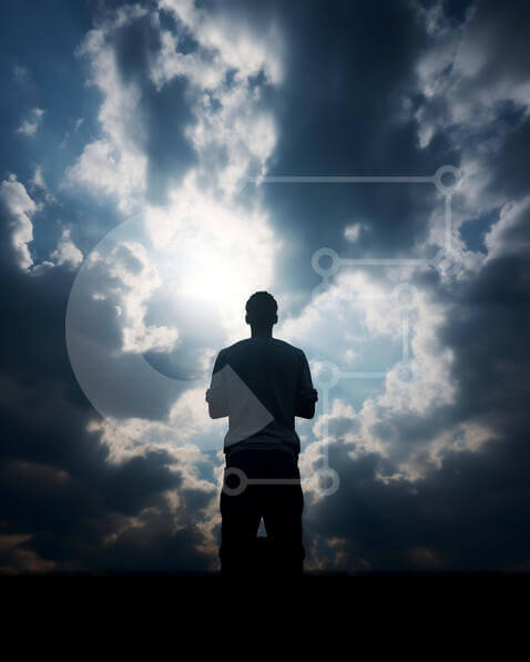 Silhouetted Man Looking at Sky and Clouds stock photo | Creative Fabrica