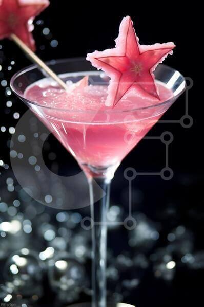 Exquisite Pink Martini Glass with Star-Shaped Garnishes stock photo ...