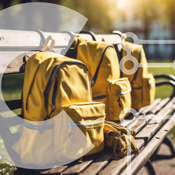 Neatly Arranged Yellow Backpacks in Park stock photo | Creative Fabrica