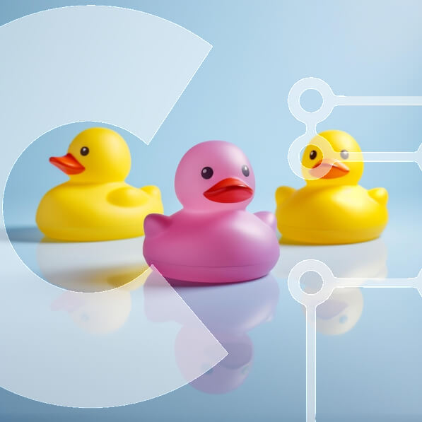Colorful Rubber Ducks on Blue Surface stock photo | Creative Fabrica