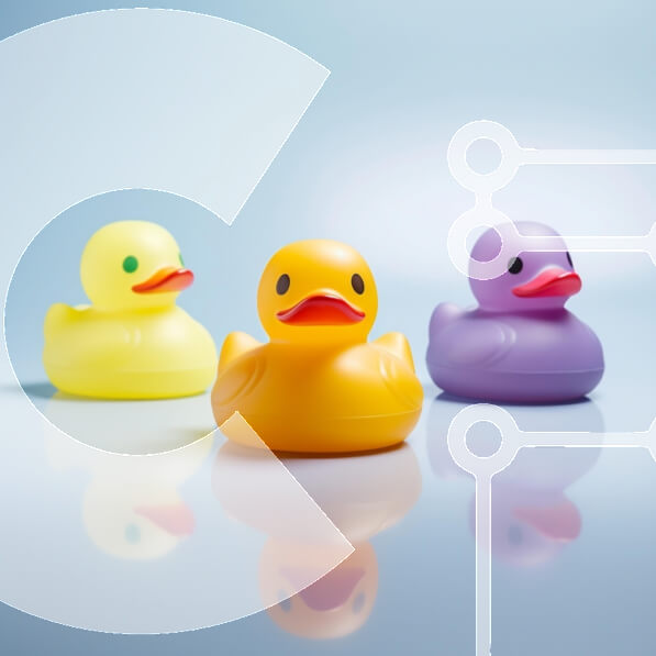 Colorful Rubber Ducks on Reflective Surface stock photo | Creative Fabrica