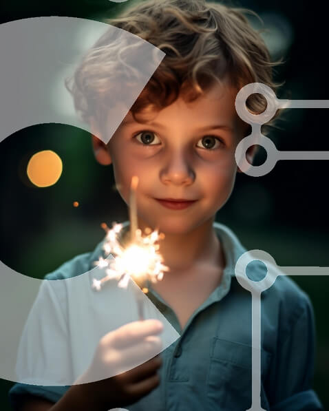 Young Boy with Illuminated Sparkler in Joyful Moment stock photo ...