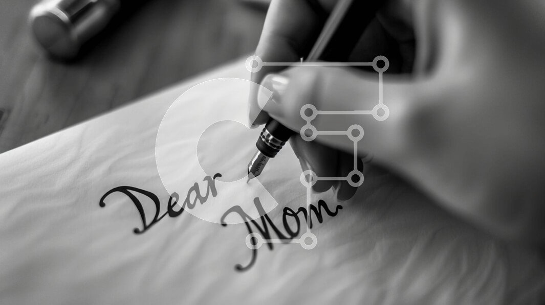 Download Person Writing 'Dear Mom' on Envelope Stockphotos Online ...