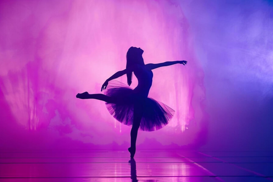 Download Ballerina Dancing in Front of Purple and Pink Lighting ...