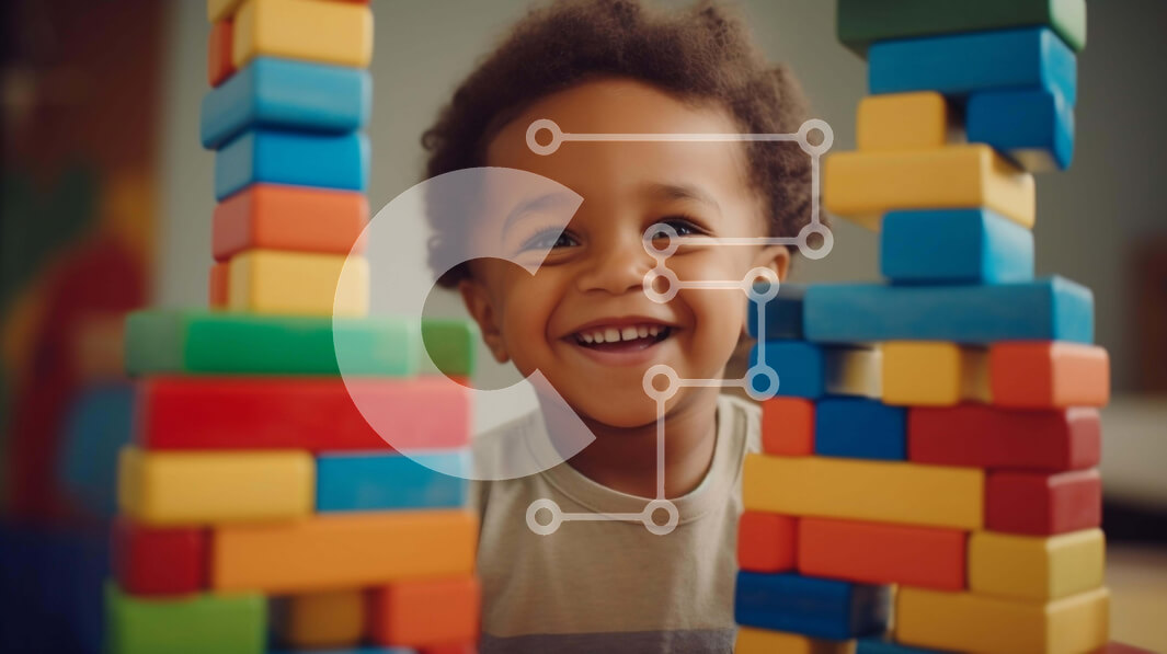 Joyful Moment: Young Boy Playing with Colorful Building Blocks stock ...