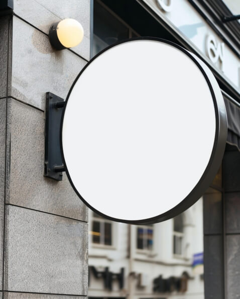 Descarga Letrero circular blanco en edificio Mockups En Línea ...