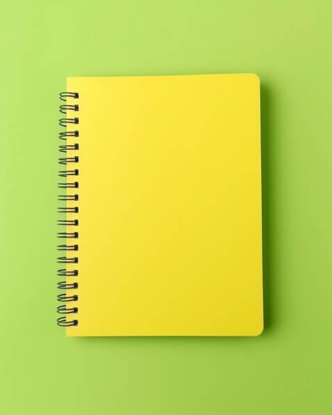 Download Yellow Spiral Notebook on Green Background Mockups Online ...