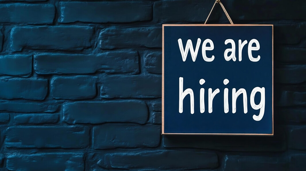 Download Hiring Sign Against Blue Brick Wall Backgrounds Online ...