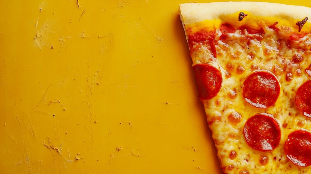 Download Slice of Pepperoni Pizza on Yellow Background Backgrounds ...