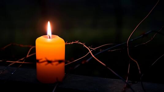 Candle and Barbed Wire Contrast stock photo | Creative Fabrica